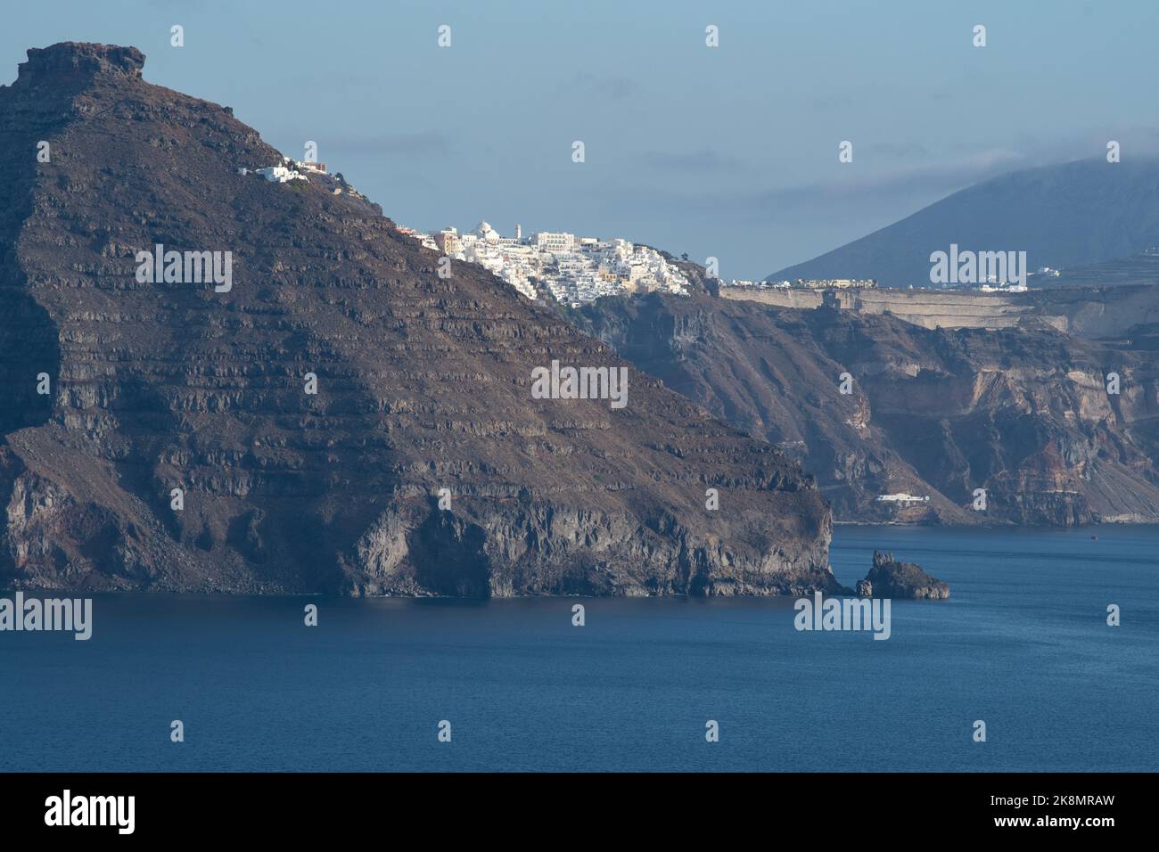 A beautiful shot of cliffs of Santorini island against a blue sky Stock ...