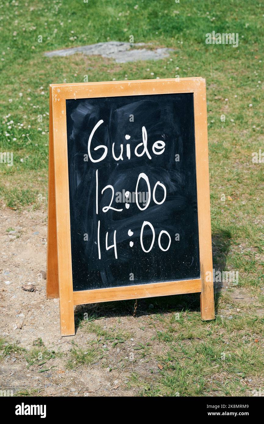 A chalkboard signage guide on the field Stock Photo - Alamy