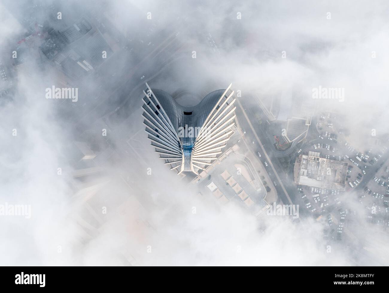 The top view from the foggy sky to the NBK building in Sharq Stock ...