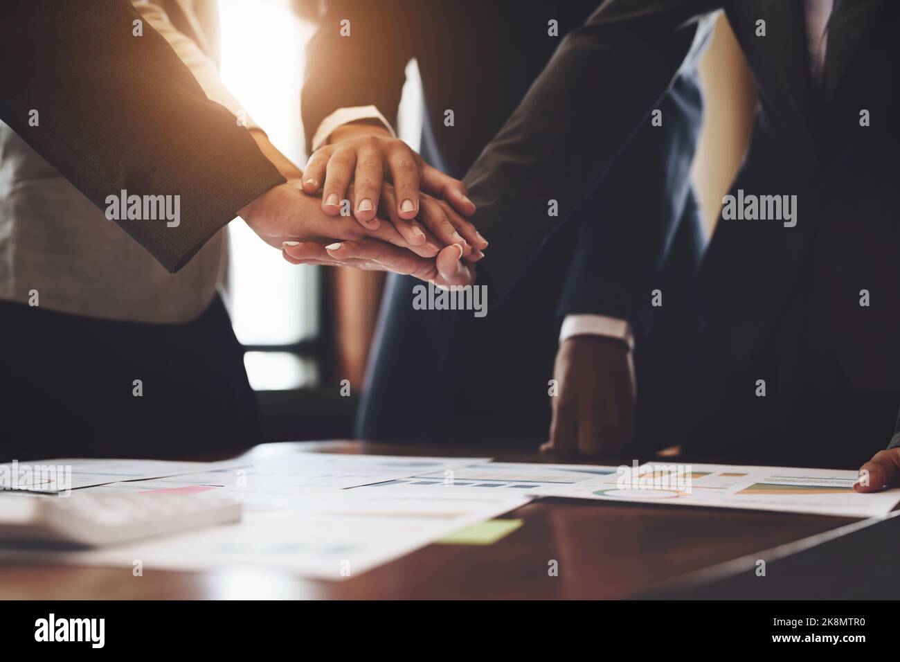 Group of business people showing merger symbol, together concept Stock ...