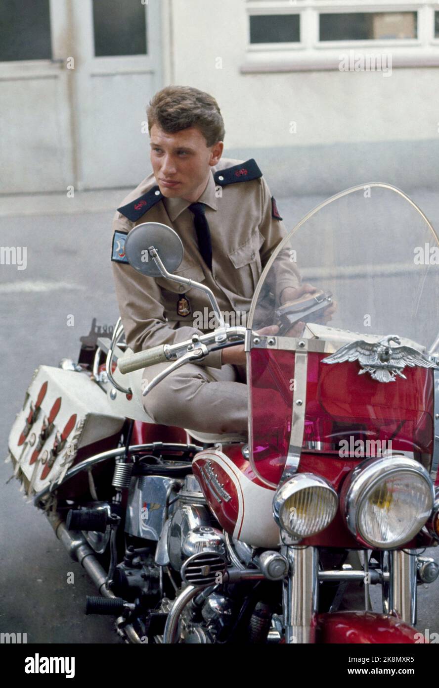 French singer Johnny Hallyday seated on his Harley Davidson during his ...