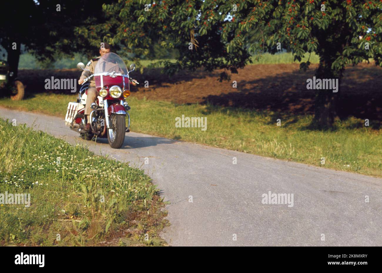 French singer Johnny Hallyday driving his Harley Davidson during his ...