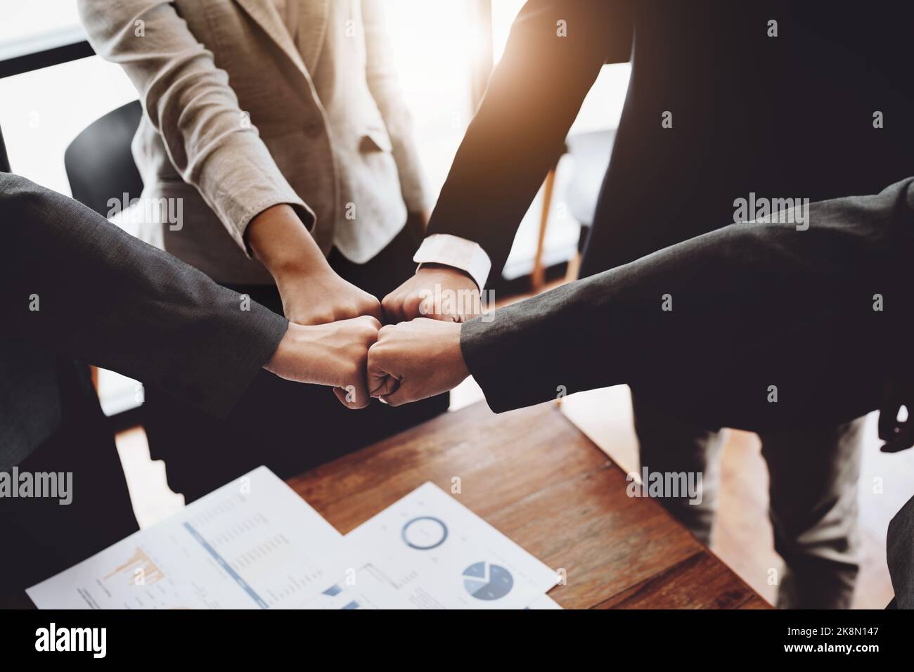 Group of business people showing merger symbol, together concept Stock ...