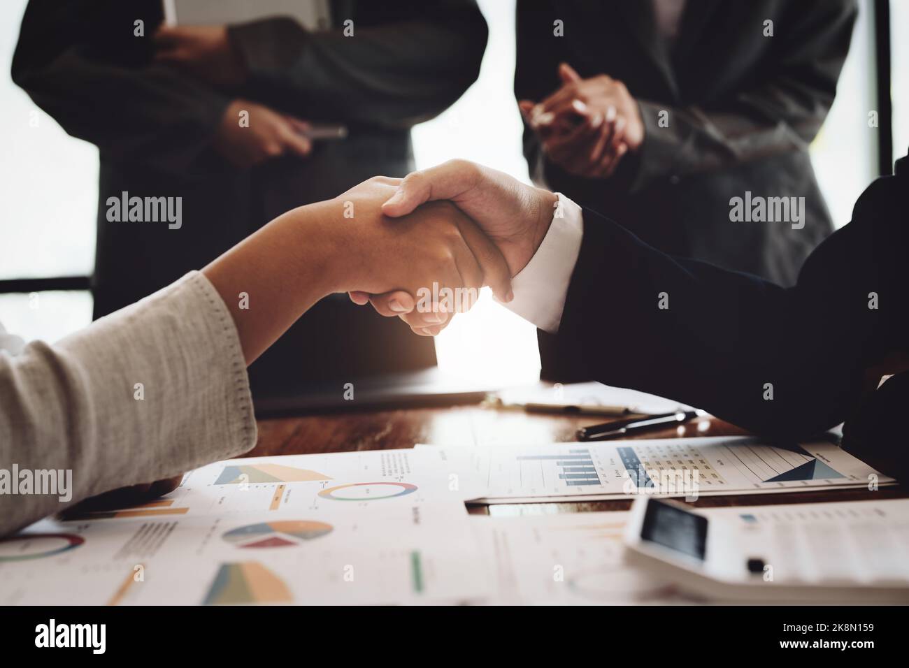 The handshake symbolizes the merger, together concept Stock Photo - Alamy