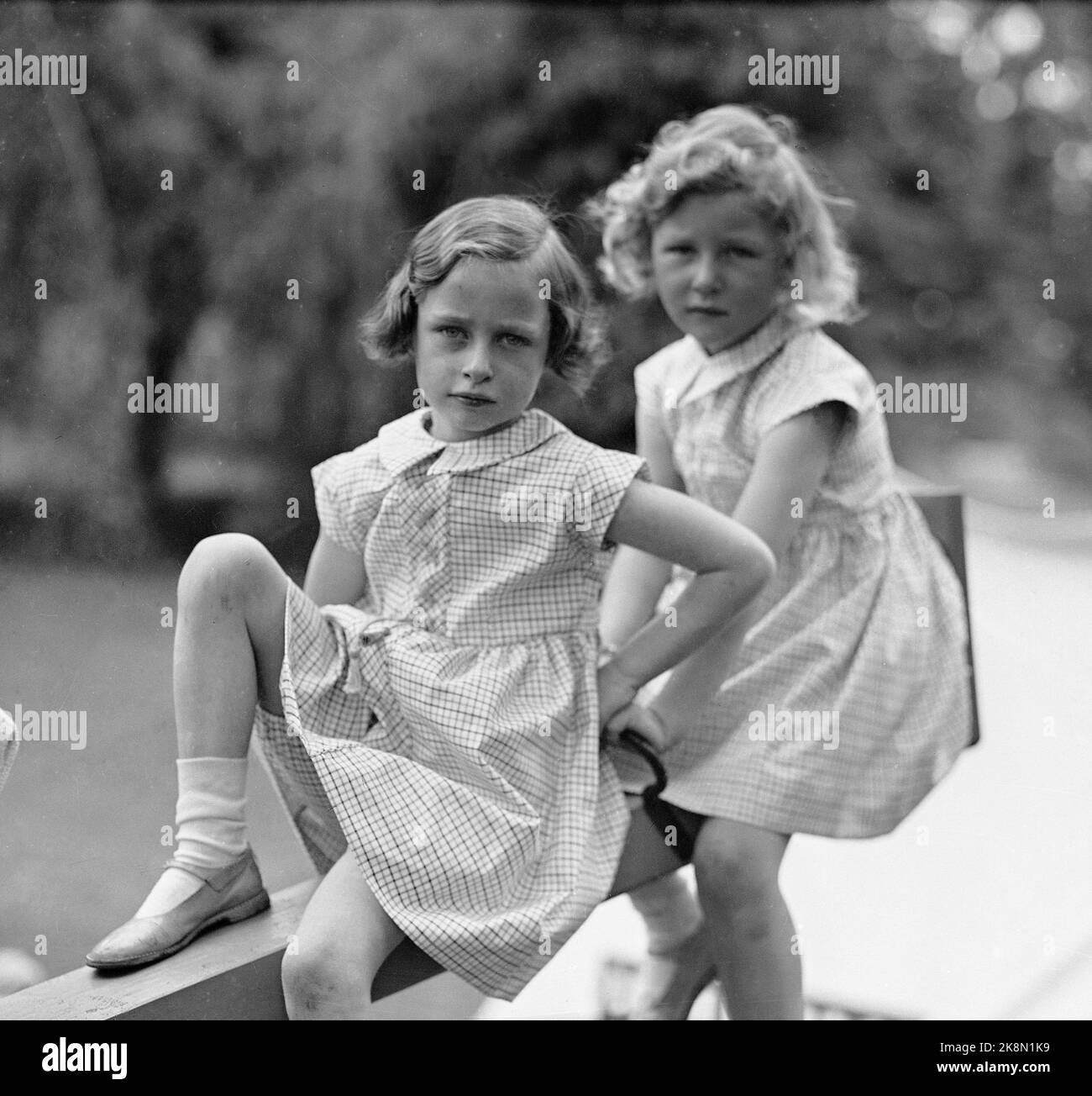 Skaugum June 1937. Princess Ragnhild (TV) and Princess Astrid play in ...