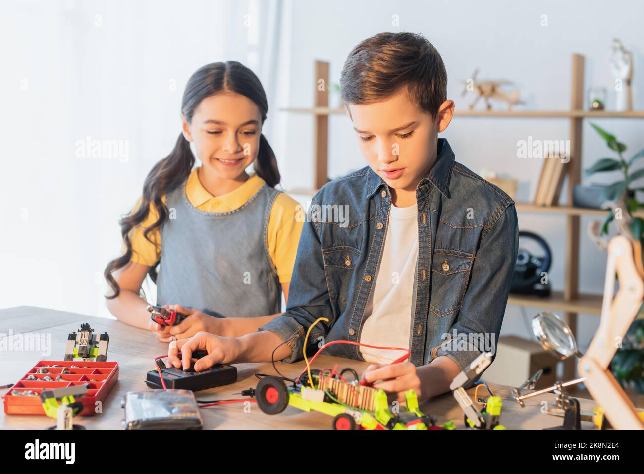 Preteen kids making robotic model at home,stock image Stock Photo - Alamy