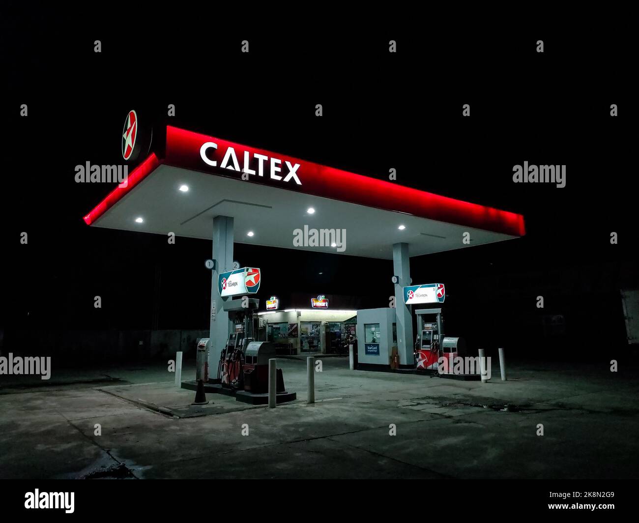 A view of the empty Caltex gas station with equipment at night Stock ...