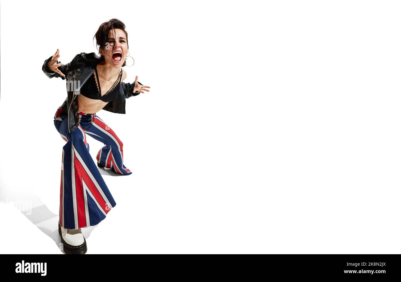 Portrait of beautiful young woman, rock music lover posing with ...