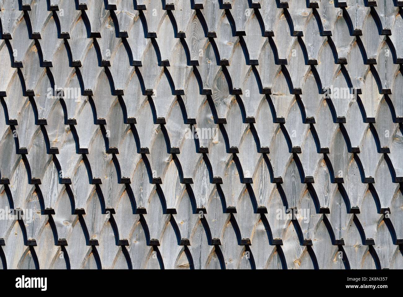 The ornamented rooftop of the Ringebu Stave Church with a square window ...