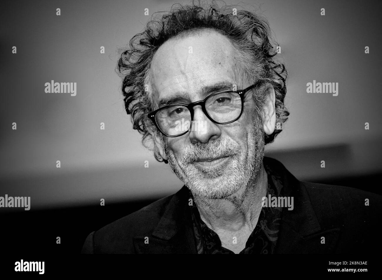 Tim Burton acknowledges the audience onstage the Lumiere Award ceremony ...