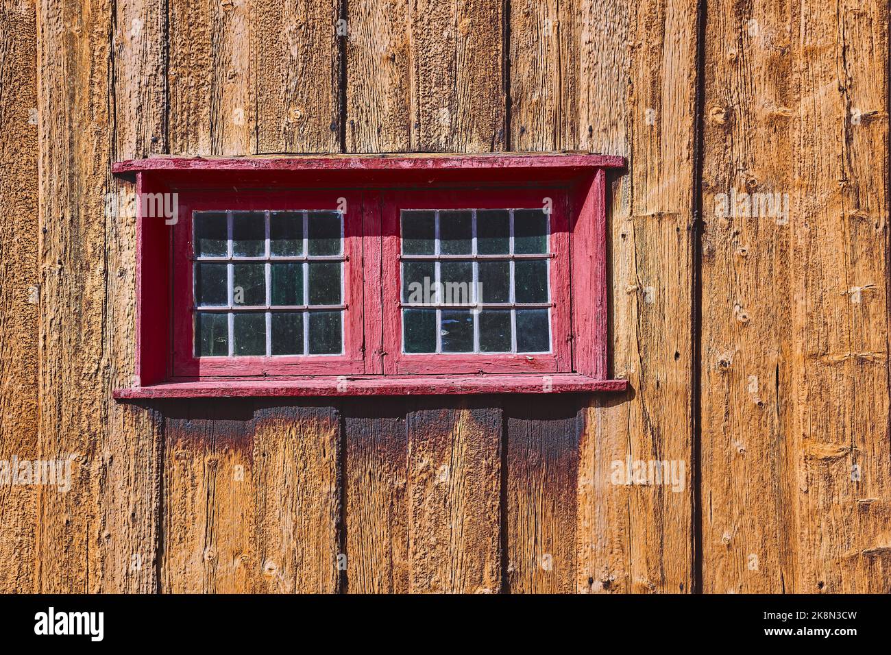 The wooden wall of the Ringebu Stave Church with a square window in ...