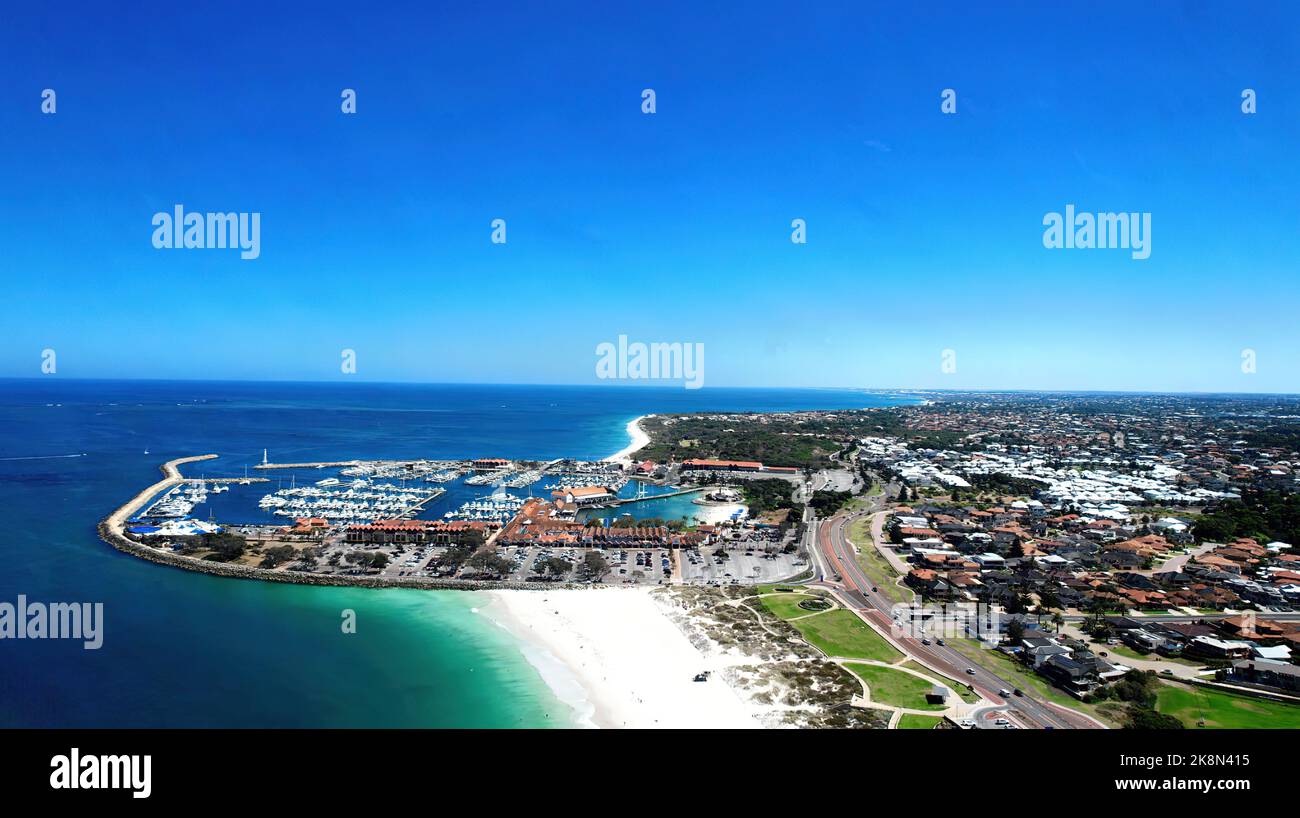 An aerial view of the waterside city buildings under the blue sky in ...