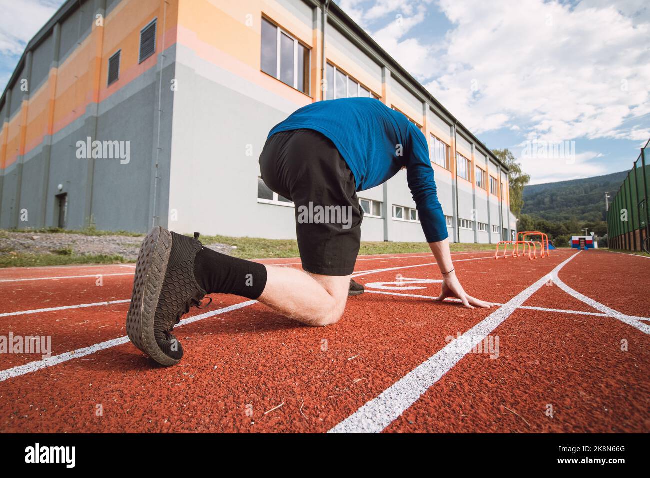 Detail of the body position of a professional athlete at the start of a ...
