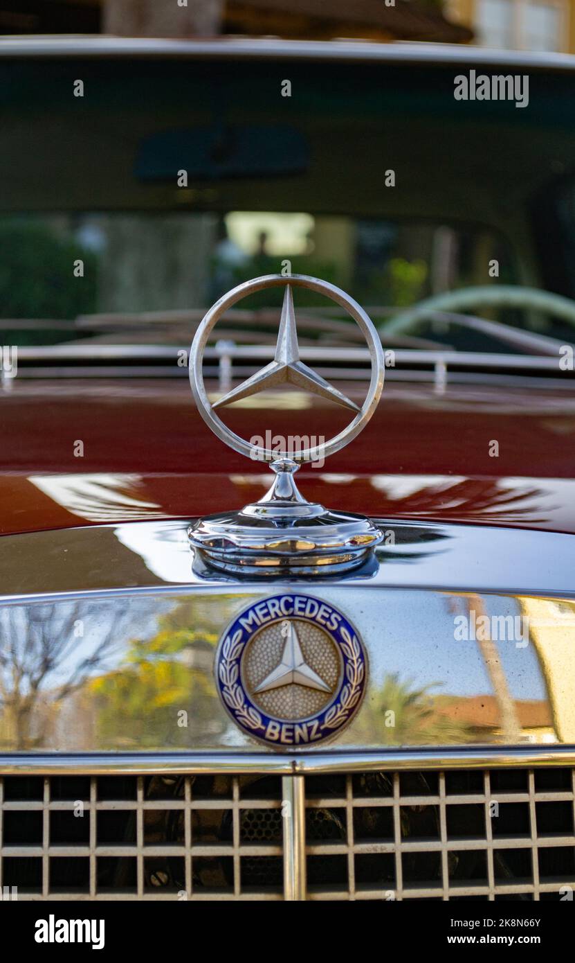 The vertical close-up view of a Mercedes Benz classic car frontal logo ...