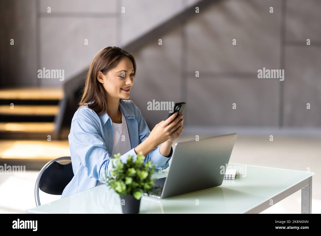 Photo of adorable young lady hold telephone look screen palm keyboard ...