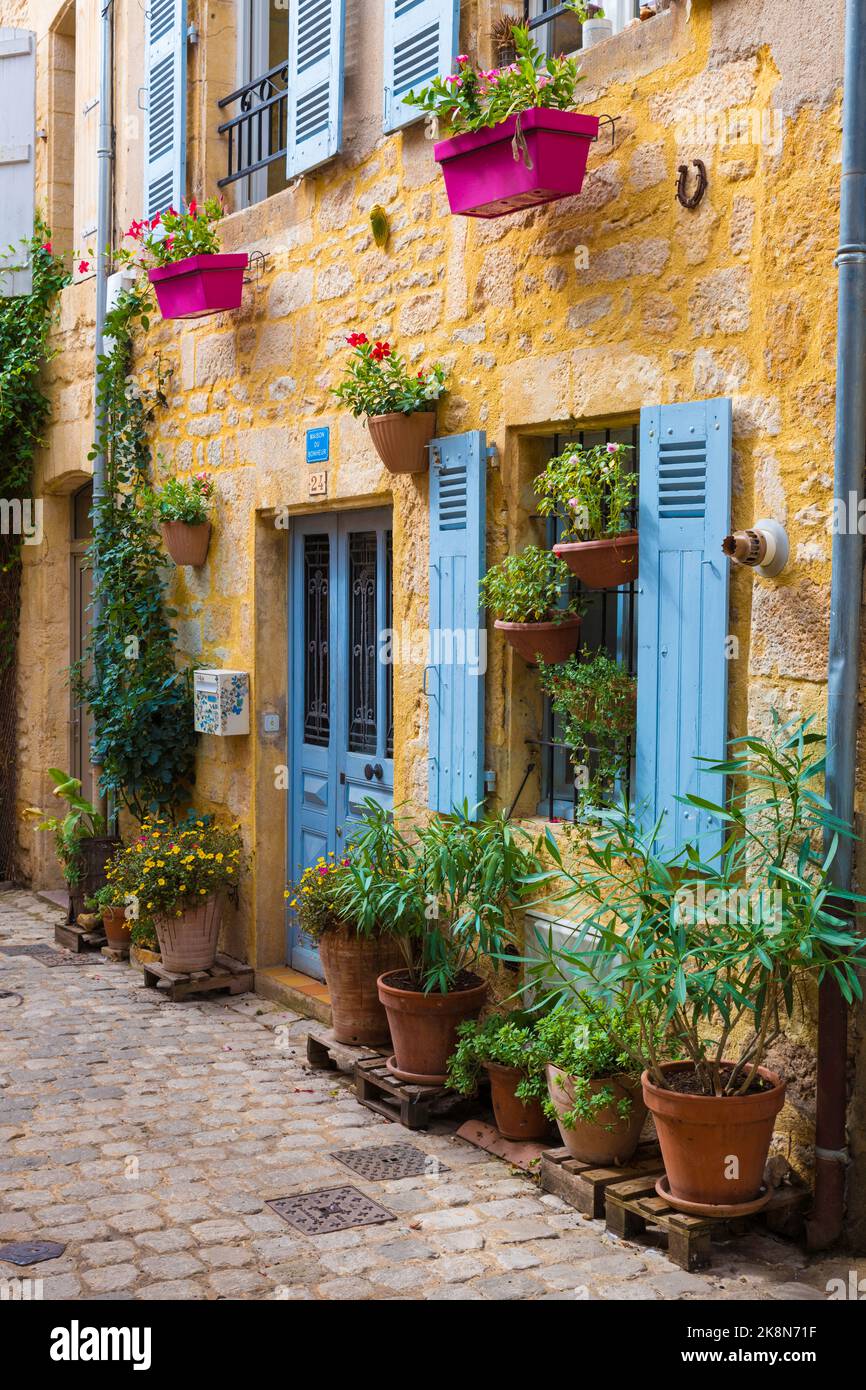 a small old street in a French village with limestone houses Stock ...