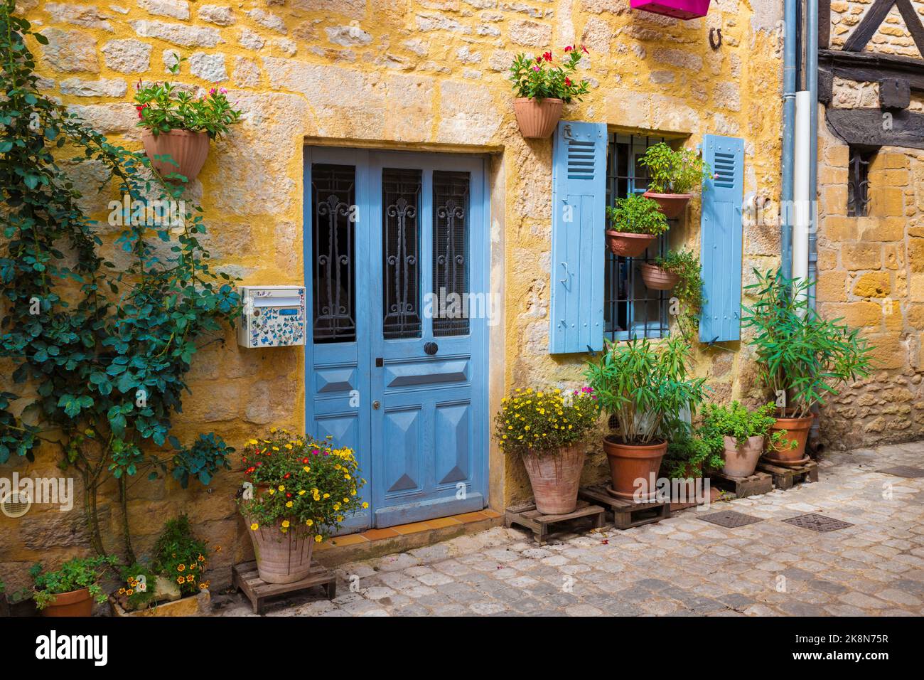 a small old street in a French village with limestone houses Stock ...
