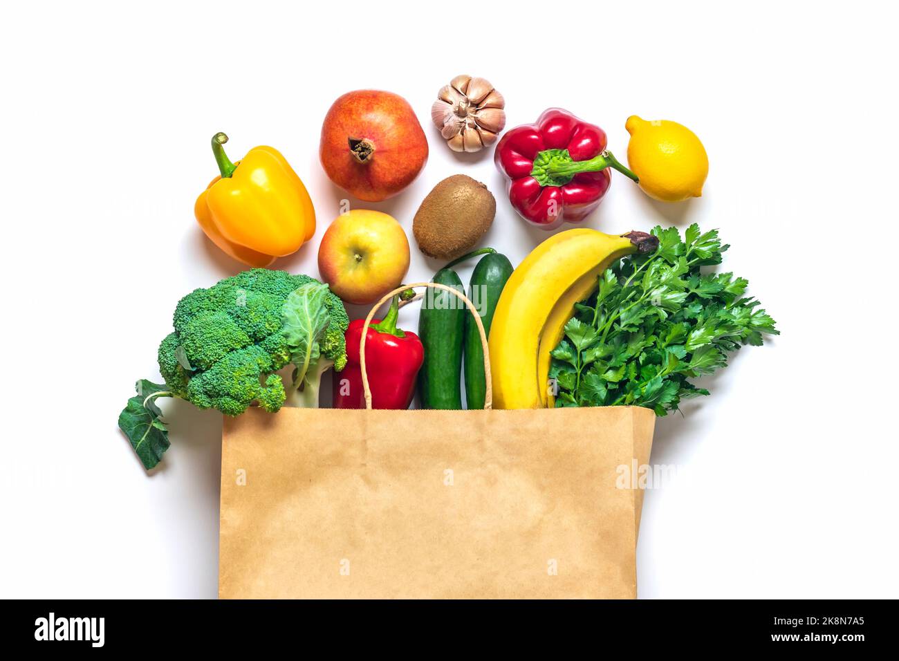 Eco friendly paper shop bag with raw organic green vegetables isolated ...