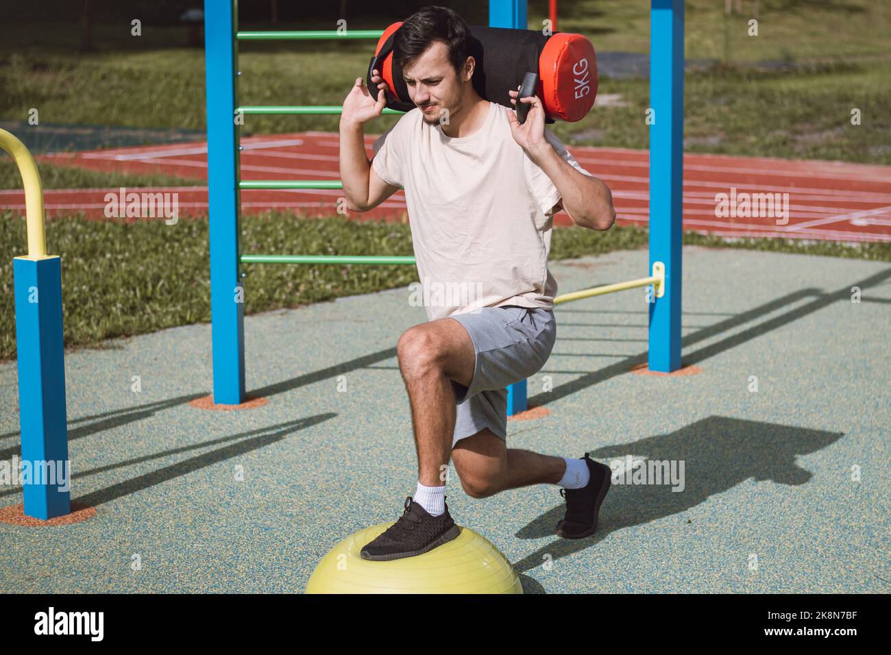 ambitious athlete is preparing for the competition season. A man with a ...