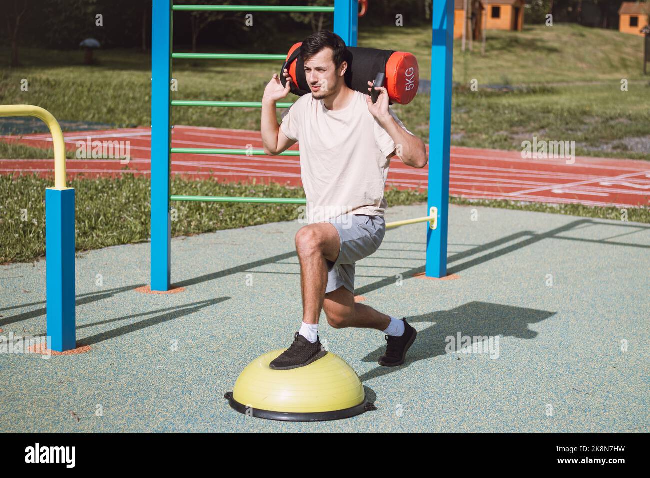 ambitious athlete is preparing for the competition season. A man with a ...