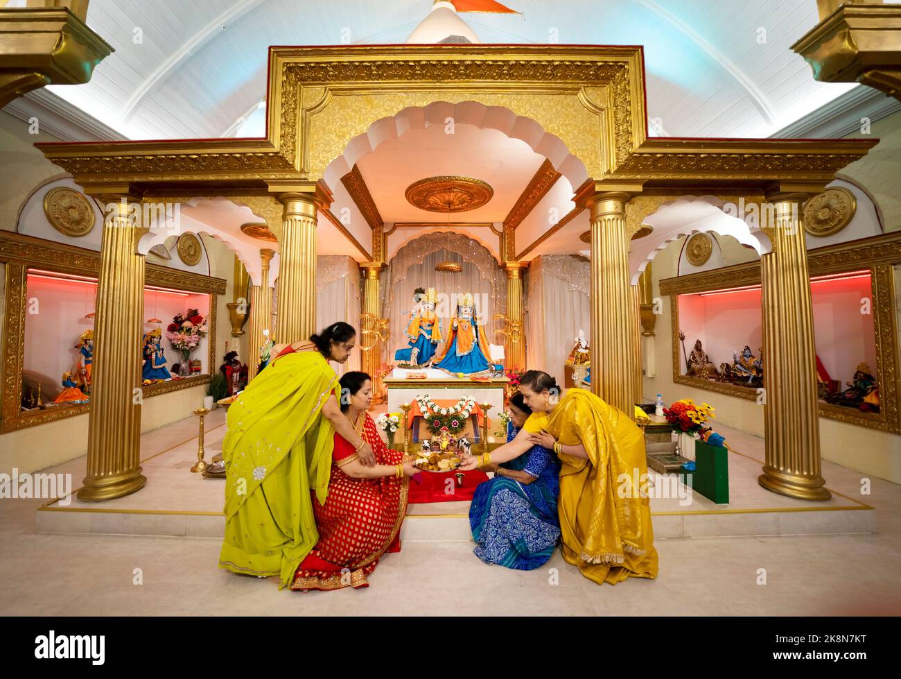 Hindu devotees pray at the Veda Mandir Hindu temple in Bolton during ...