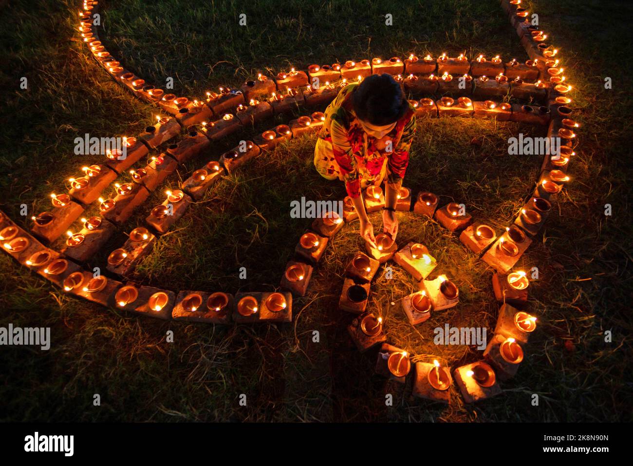 Narayanganj, Dhaka, Bangladesh. 24th Oct, 2022. Hindu devotees light ...