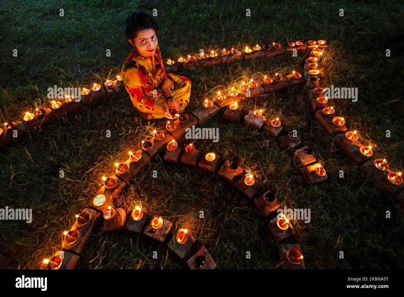 Narayanganj, Dhaka, Bangladesh. 24th Oct, 2022. Hindu devotees light ...