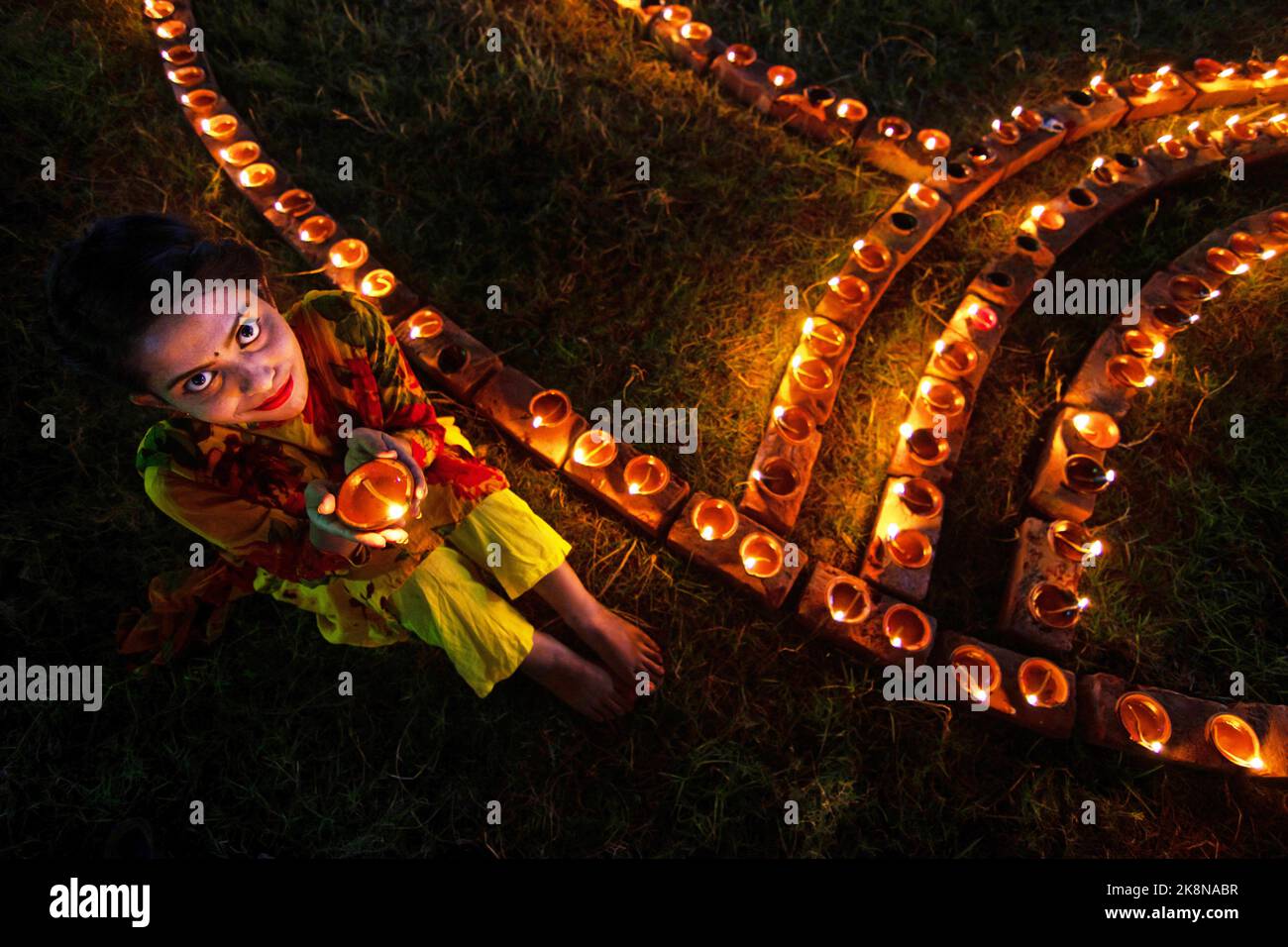 Narayanganj, Dhaka, Bangladesh. 24th Oct, 2022. Hindu devotees light ...