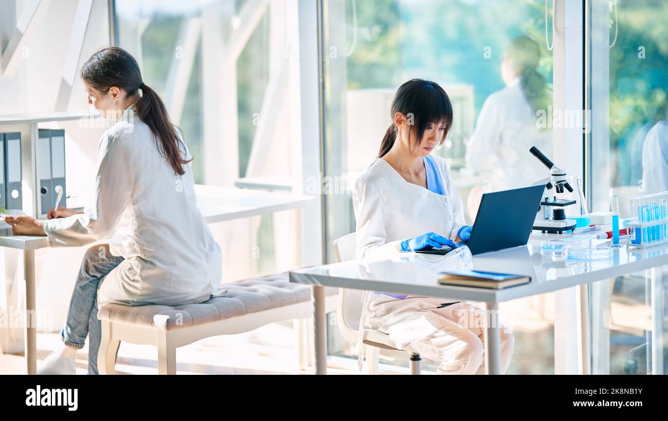 Female scientists working on their computers In modern medical research ...
