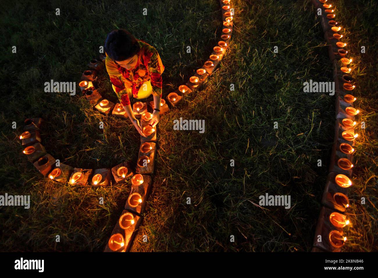 Narayanganj, Dhaka, Bangladesh. 24th Oct, 2022. Hindu devotees light ...