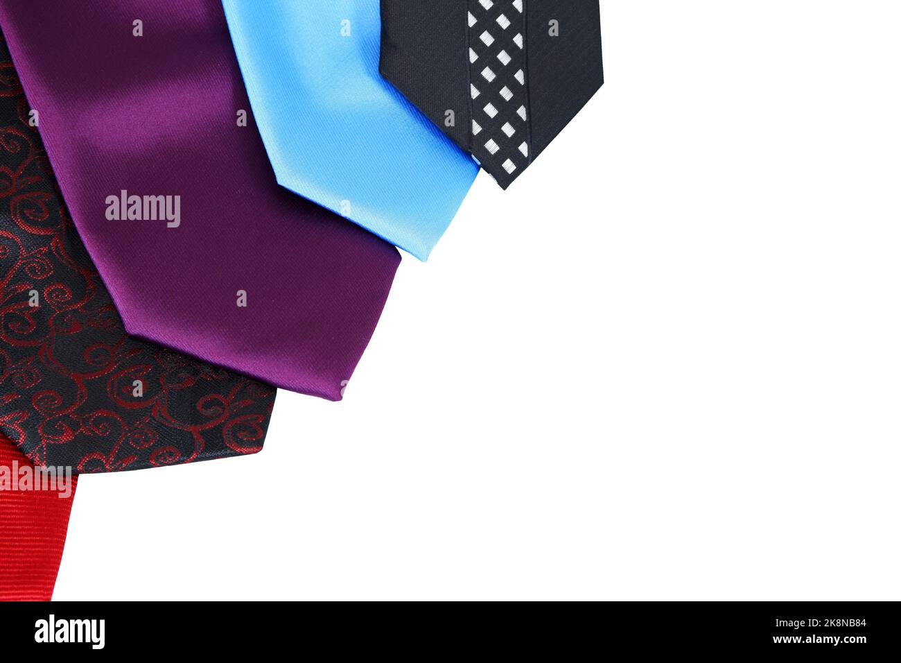The tips of colorful neckties with elegant patterns on the edge of a ...