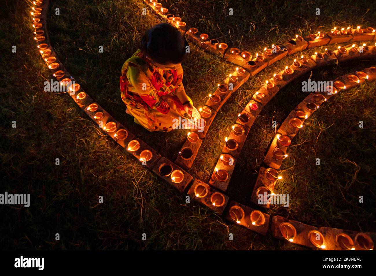 Narayanganj, Dhaka, Bangladesh. 24th Oct, 2022. Hindu devotees light ...