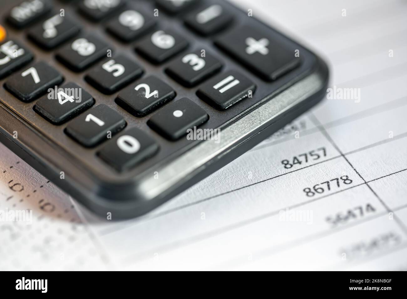 Calculator and numbers on paper closeup, finance concept Stock Photo ...