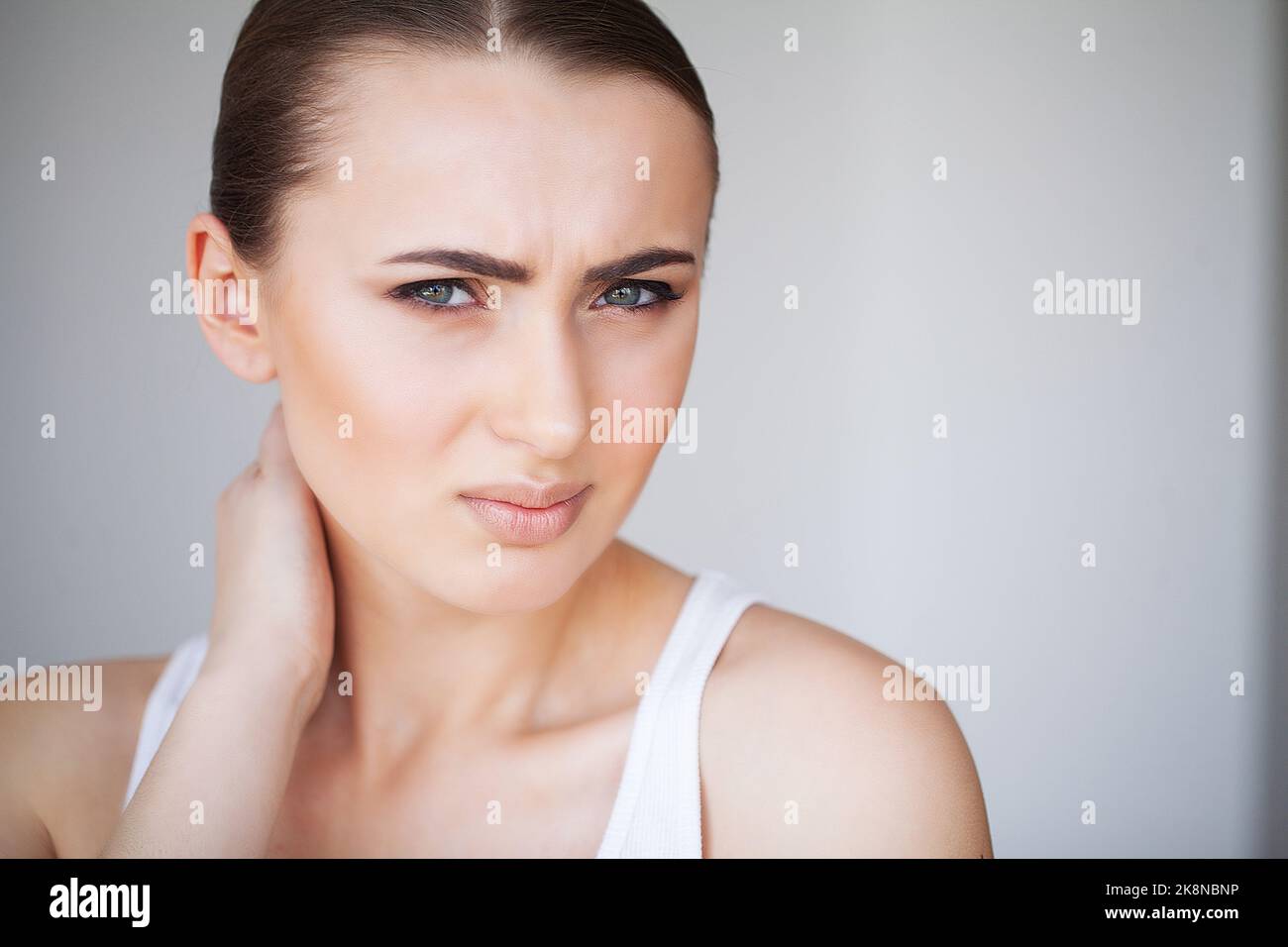Pain. Beautiful Young Woman Feeling Sick and Has a Pain in the Neck ...
