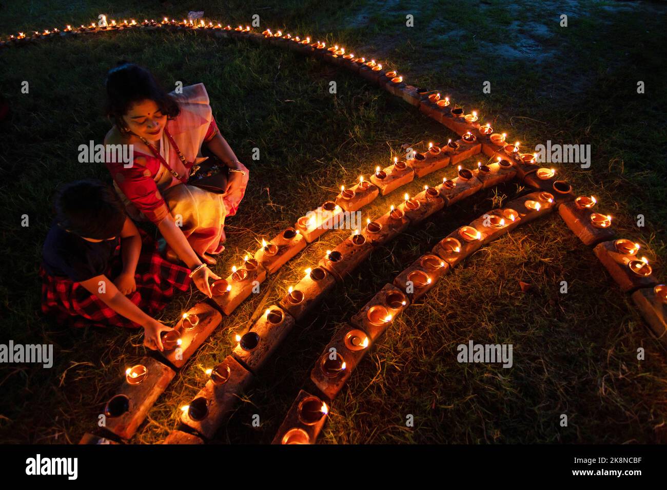 Narayanganj, Dhaka, Bangladesh. 24th Oct, 2022. Hindu devotees light ...