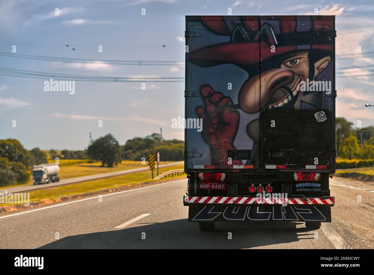 The Dick Dastardly graffiti painting on the back of the truck driving ...