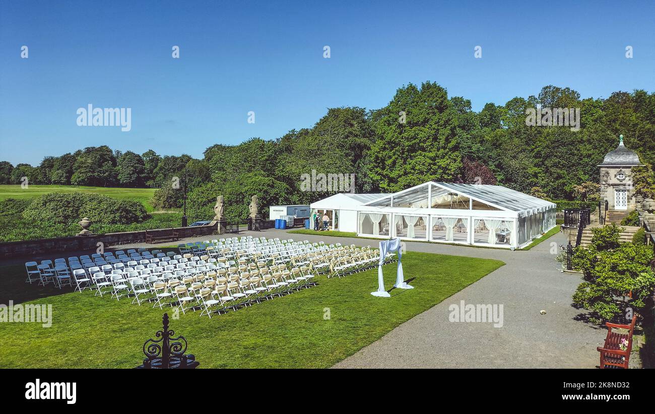 The aerial view of an empty outdoor wedding venue under the blue sky ...