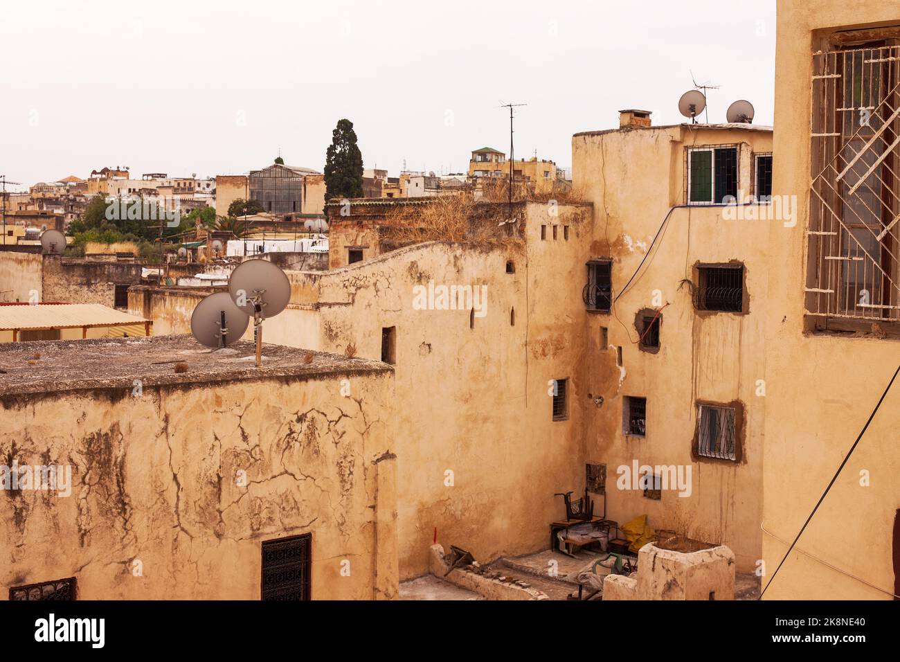 A scenic cityscape with old yellow buildings in the Medina of Fez ...