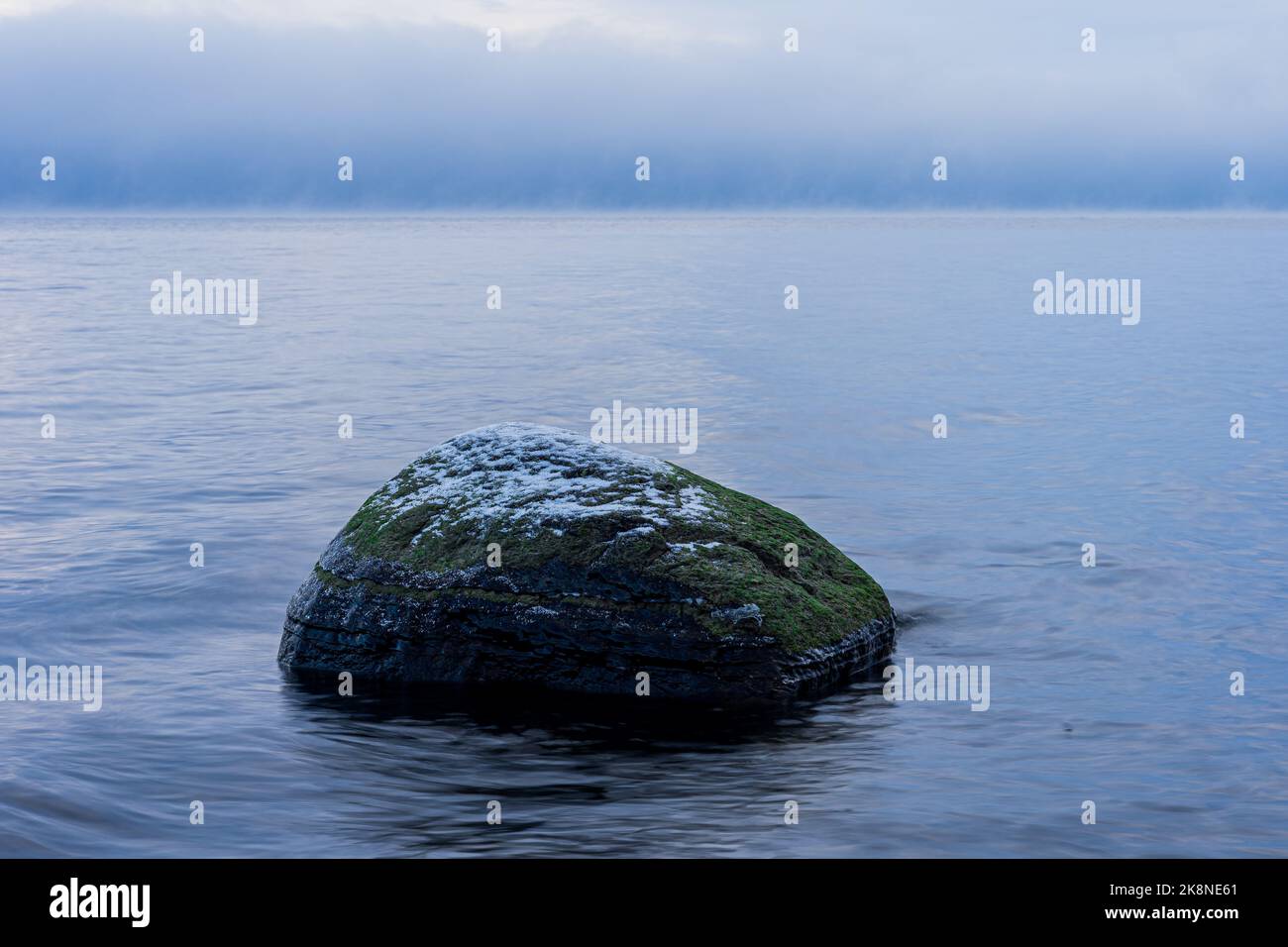 Stone in Lake MjÃ¸sa at winter Stock Photo - Alamy