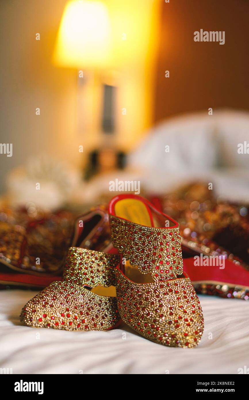 A closeup of golden Indian style bridal heals for wedding Stock Photo ...