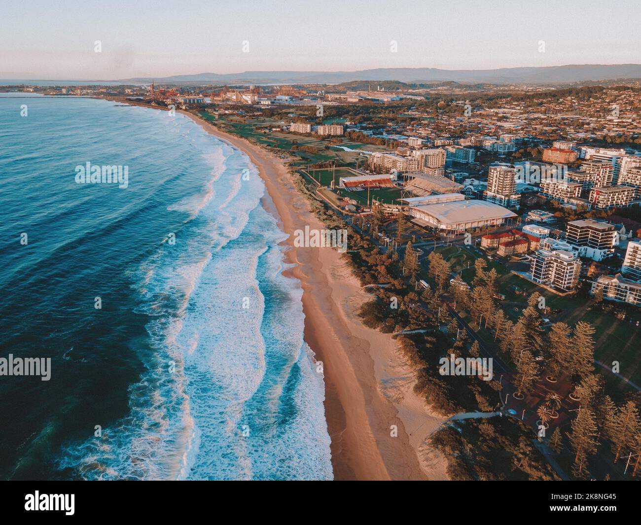 An aerial of Bronte beach with the busy highway and cityscape ...
