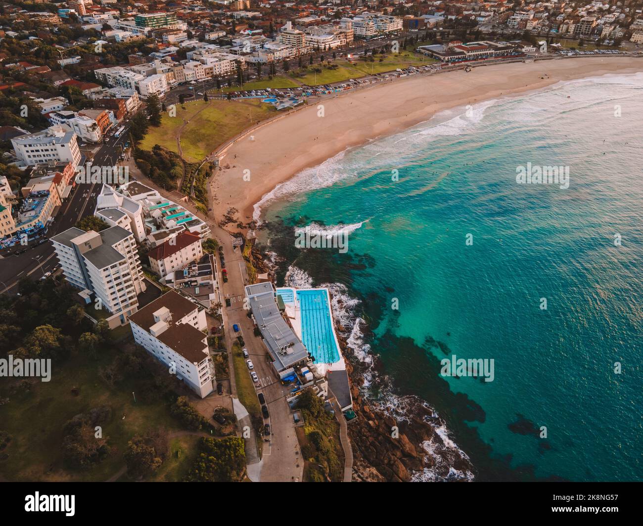 An aerial of Bronte beach with the busy highway and cityscape ...