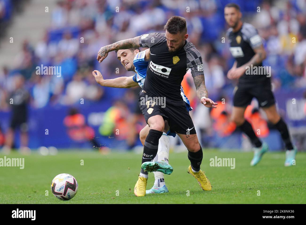 Brian Olivan of RCD Espanyol and Josan Ferrandez of Elche CF during the ...