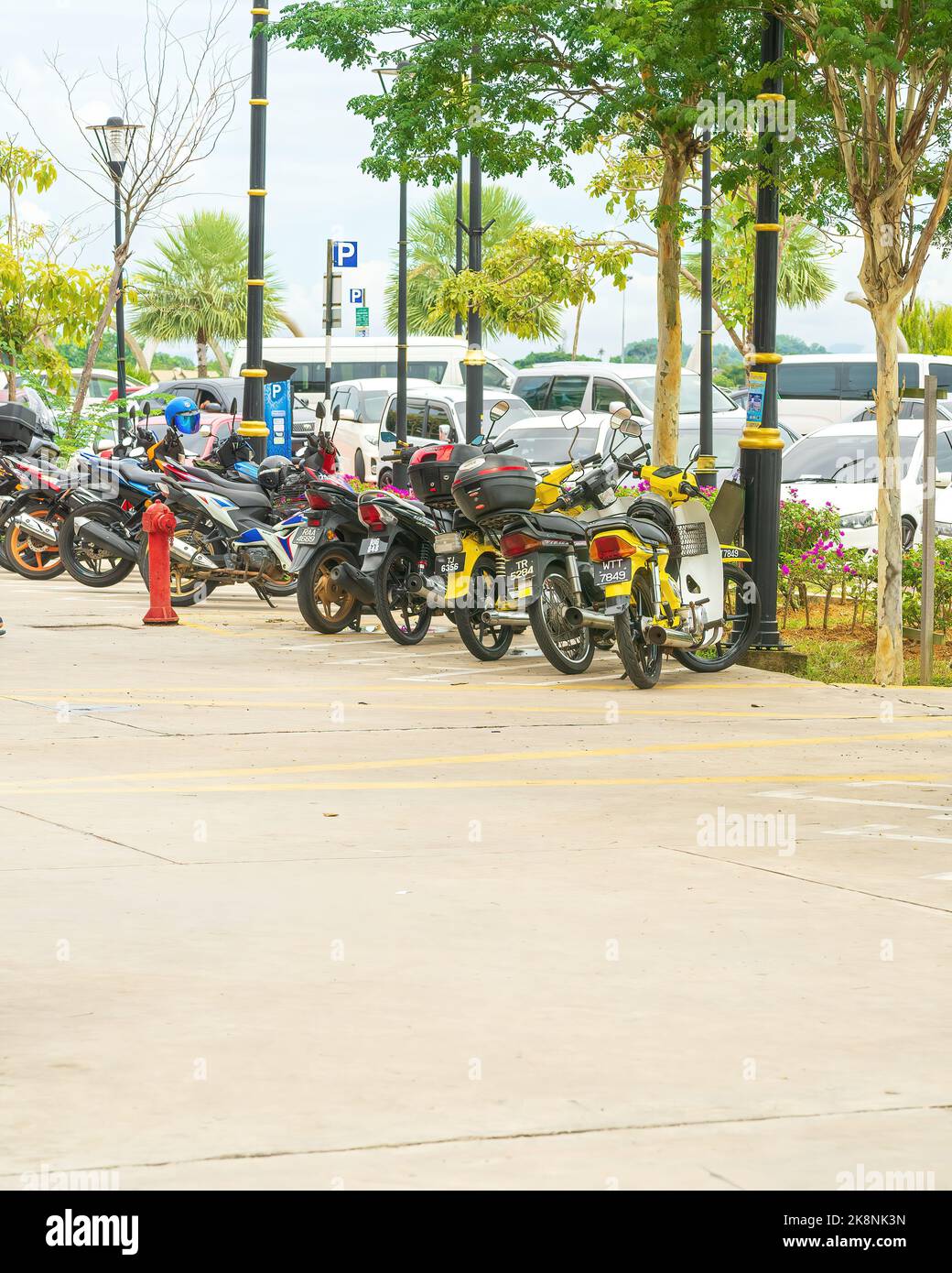 A row of motorcycle parking along the roadside during Terengganu bike ...