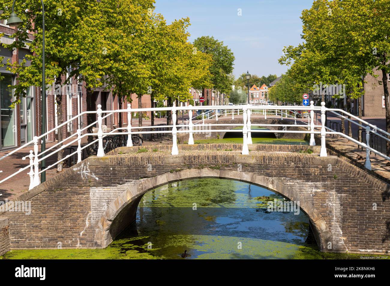Stone bridge over the canal in the center of the Dutch historic city of ...