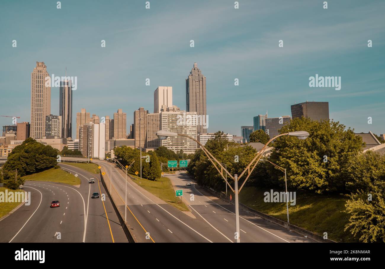 A scenic view of skyscrapers and asphalt roads under the clear sky ...