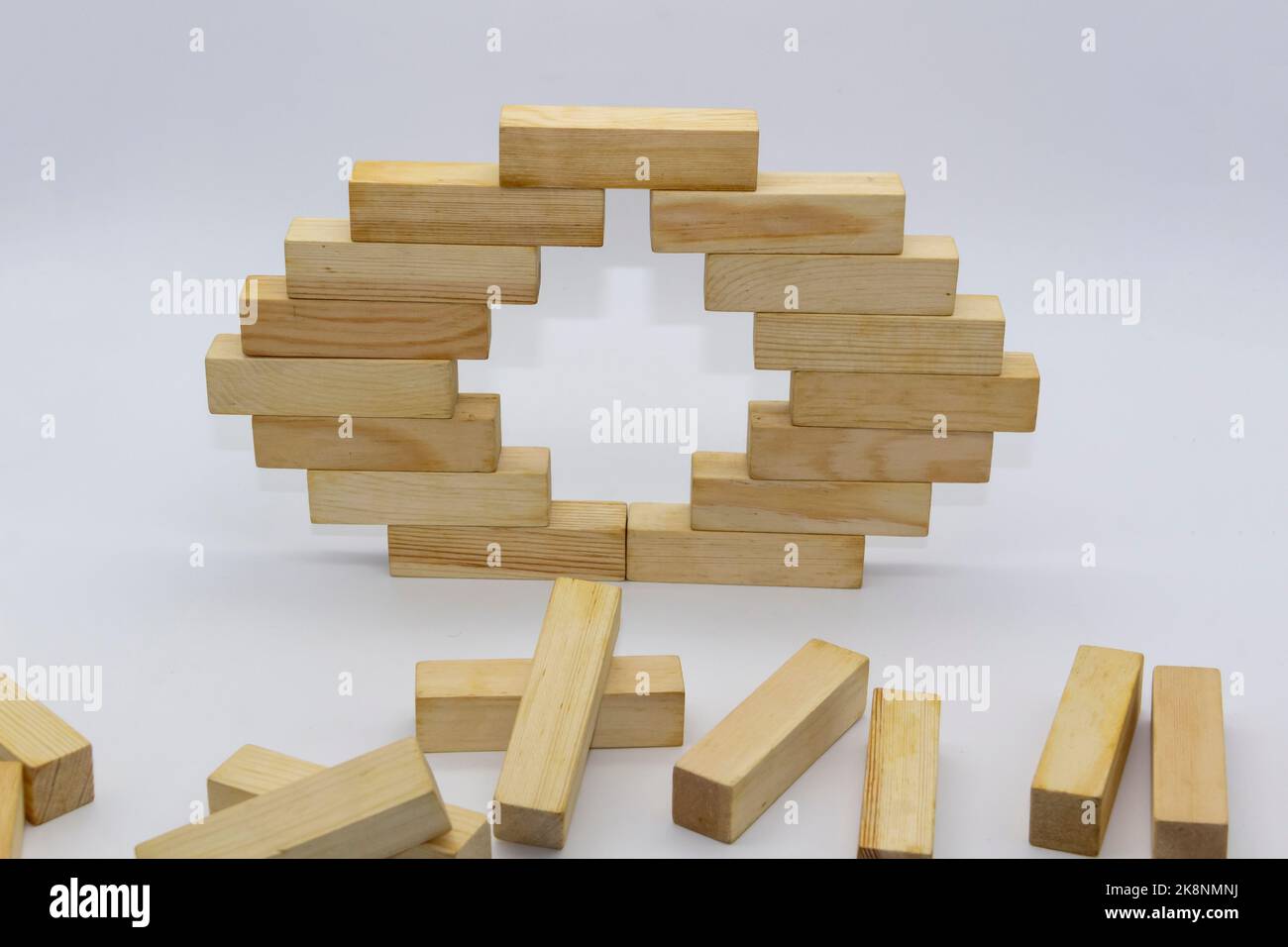 The figure made by the wooden blocks against white background. Concept ...