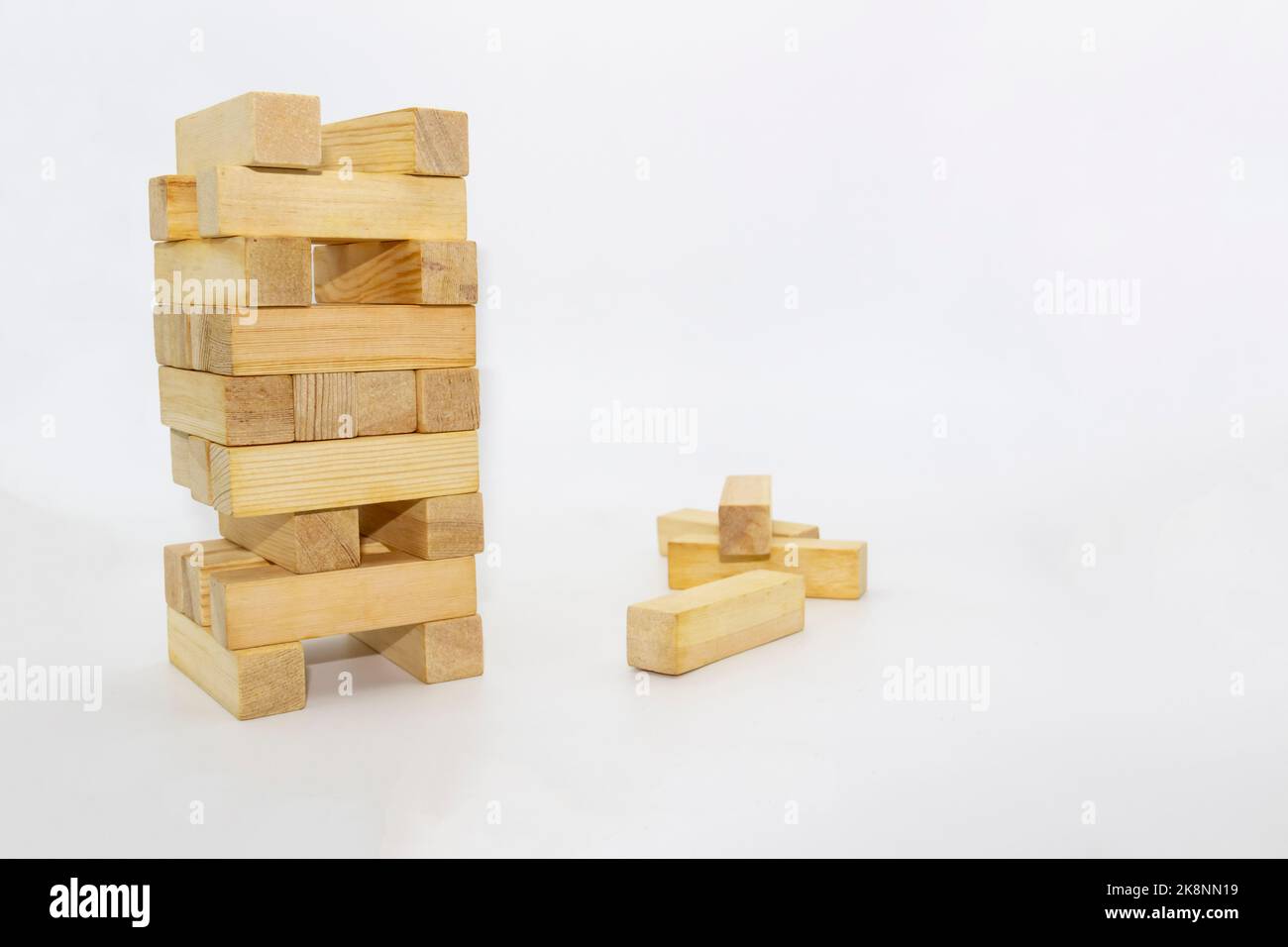 Tower wooden block, builds tower from wooden blocks against white ...