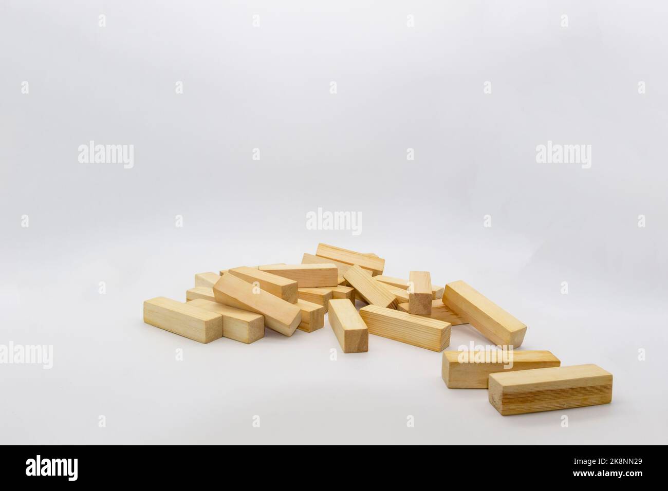 Scattered wooden blocks on the white background. The wooden bricks ...