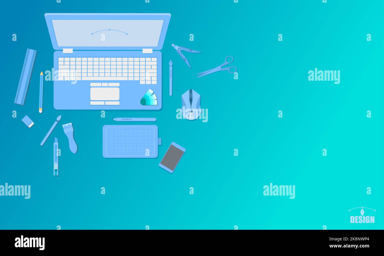 A set of engineering tools for design and a laptop on a light blue ...